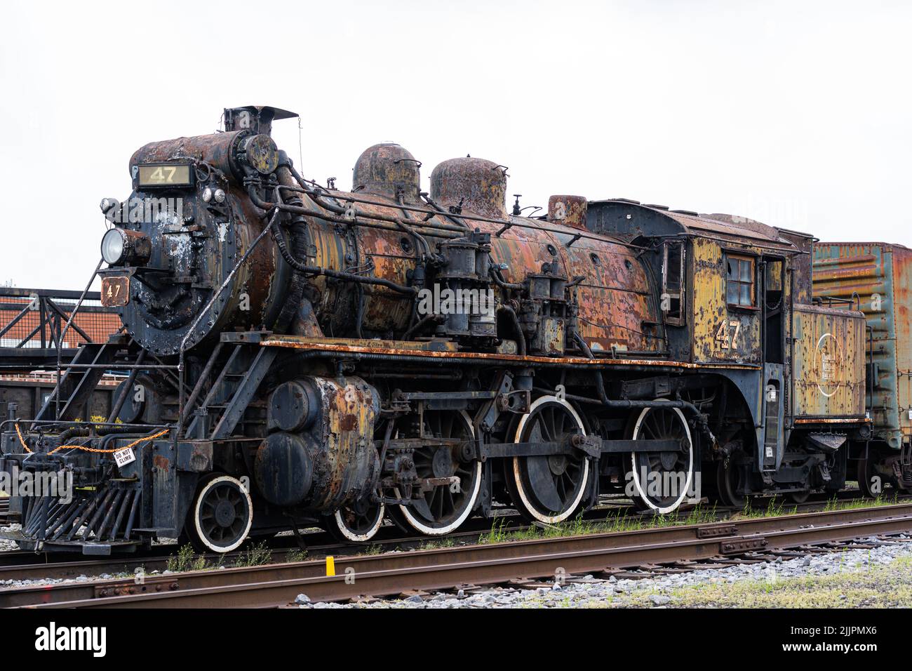 An old and historic steam train on track in a museum Stock Photo - Alamy
