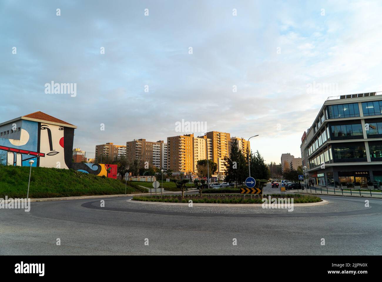 a beautiful photo of a roundabout and buildings at Lumiar, Portugal ...