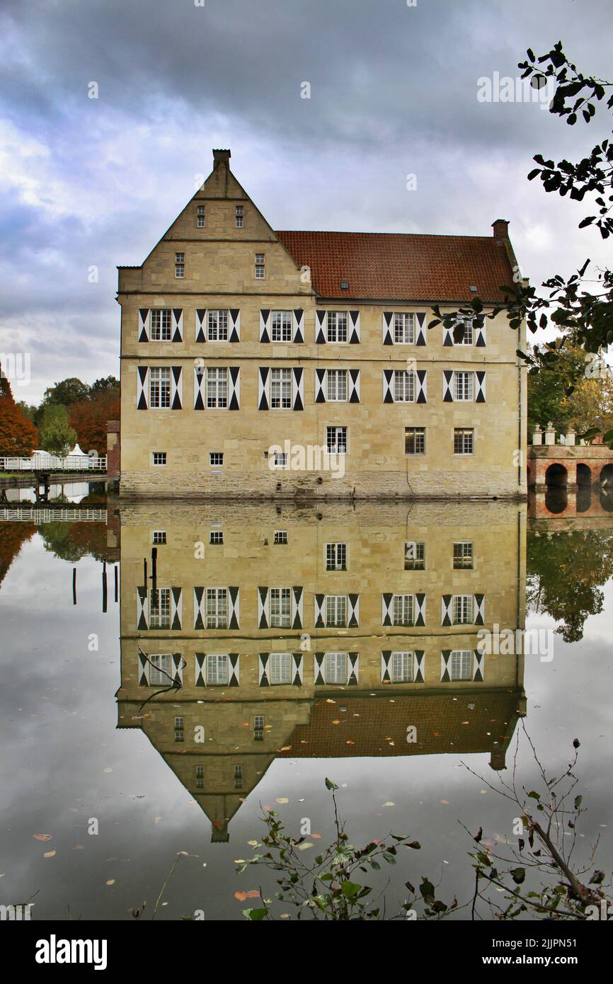 The reflection of the old castle moat Palace on the water Stock Photo ...