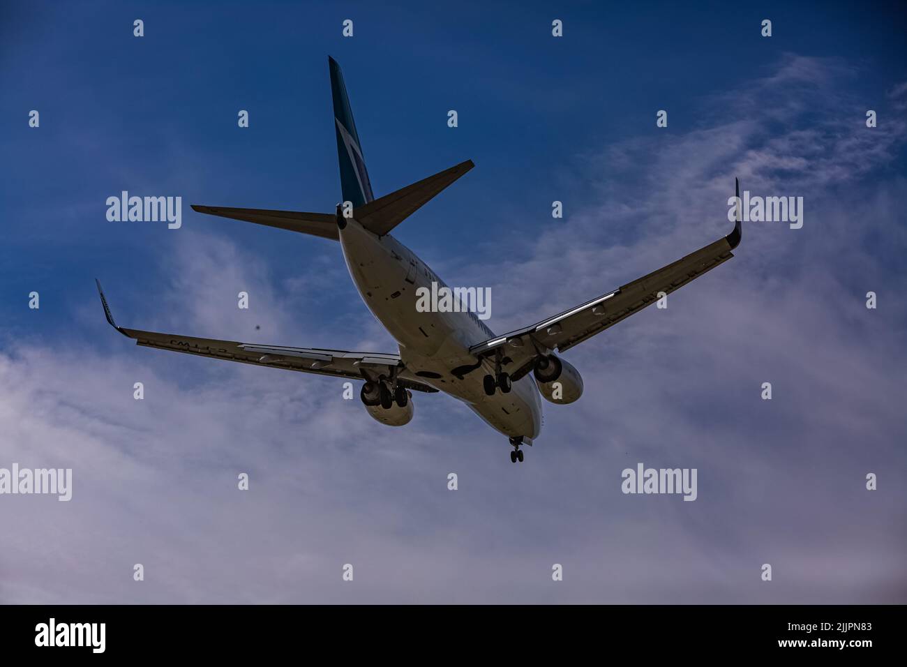 A Commercial Airliners aircraft airplane approaching landing at YVR ...