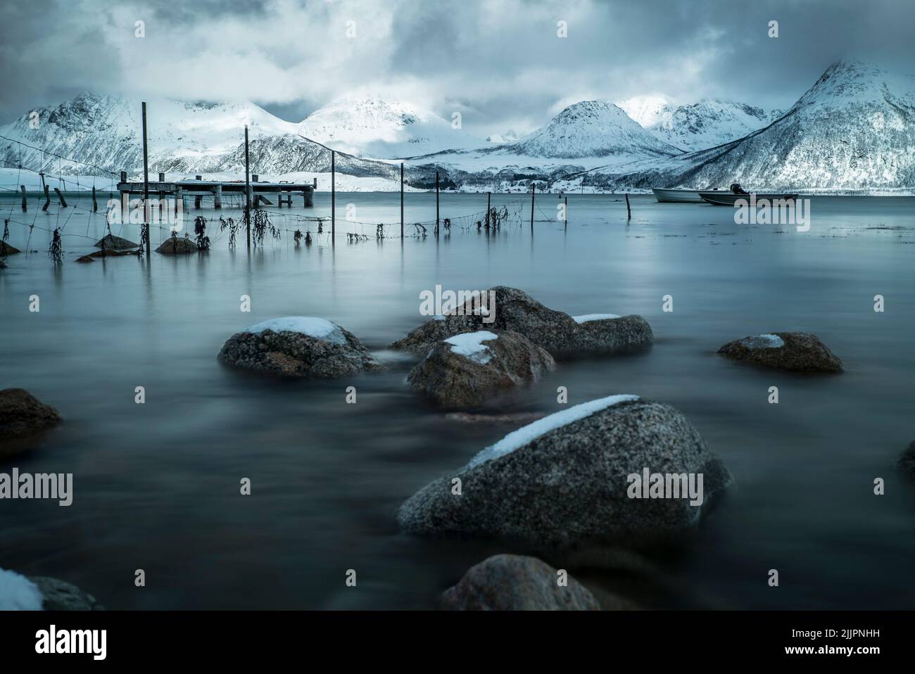 A beautiful shot a dock in Ersfjorden near Kvaloya island, Norway in ...