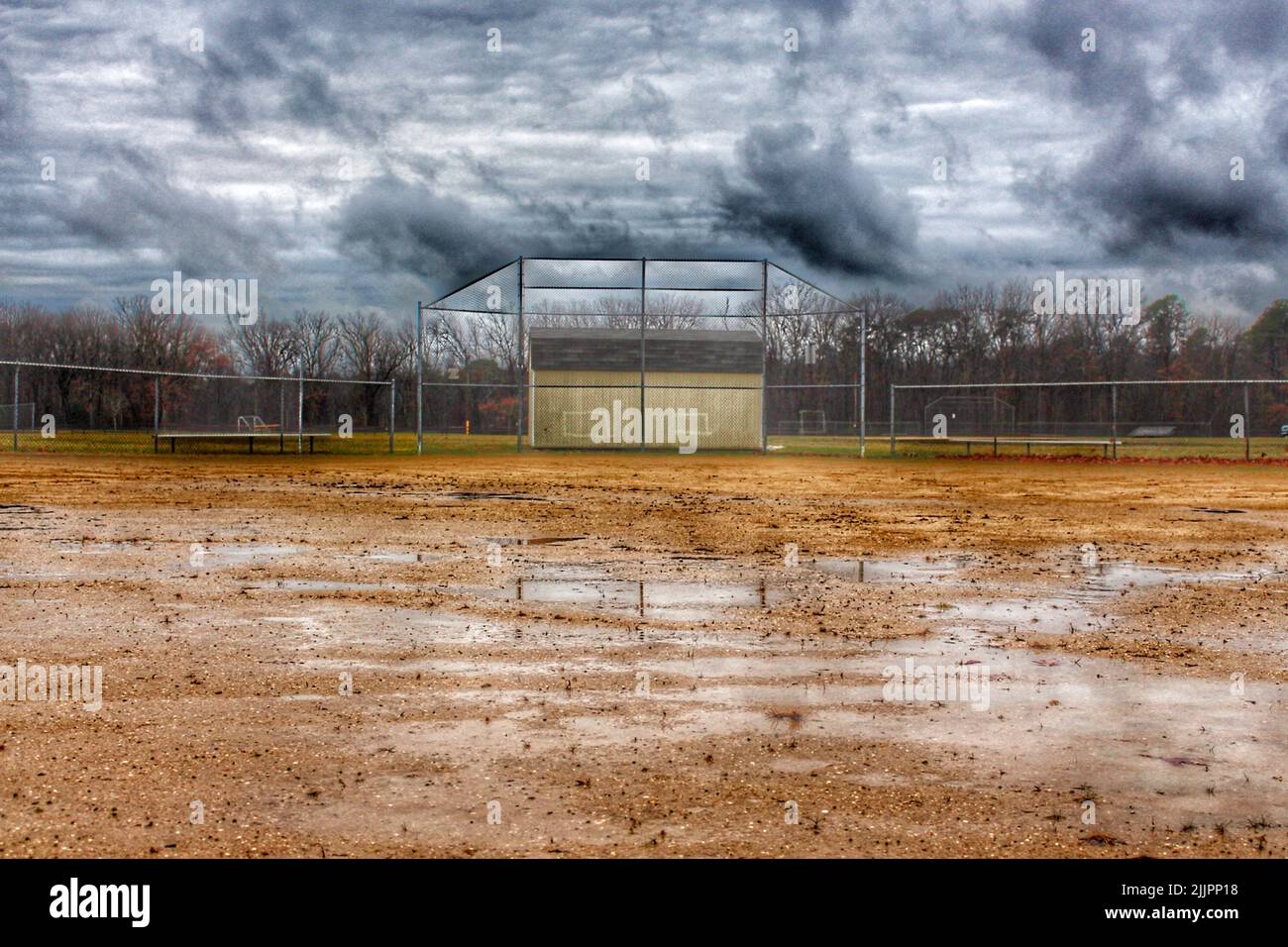 A view of a baseball field with reflective puddles Stock Photo - Alamy