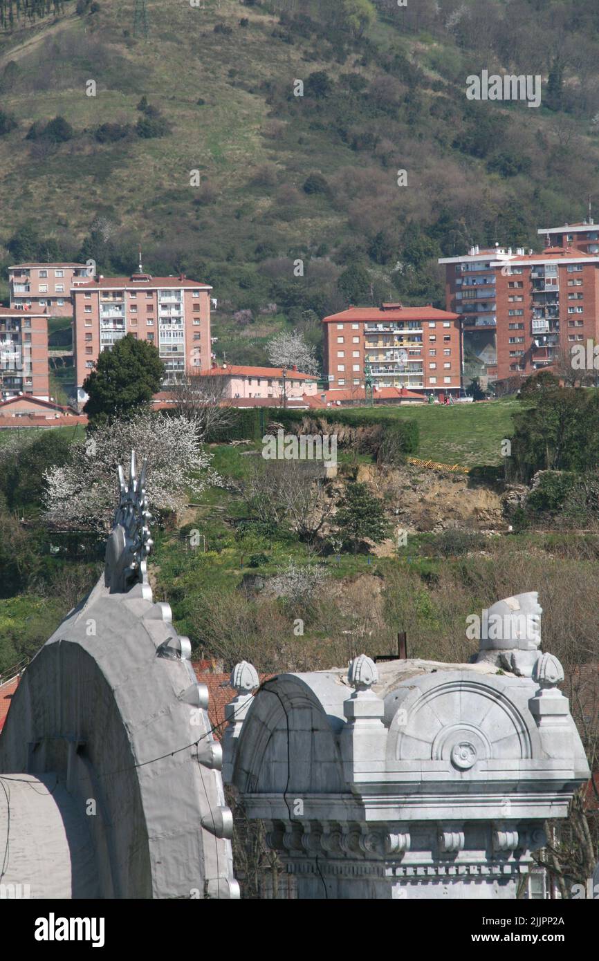 A vertical distant view of residential buildings in the city of Bilbao ...