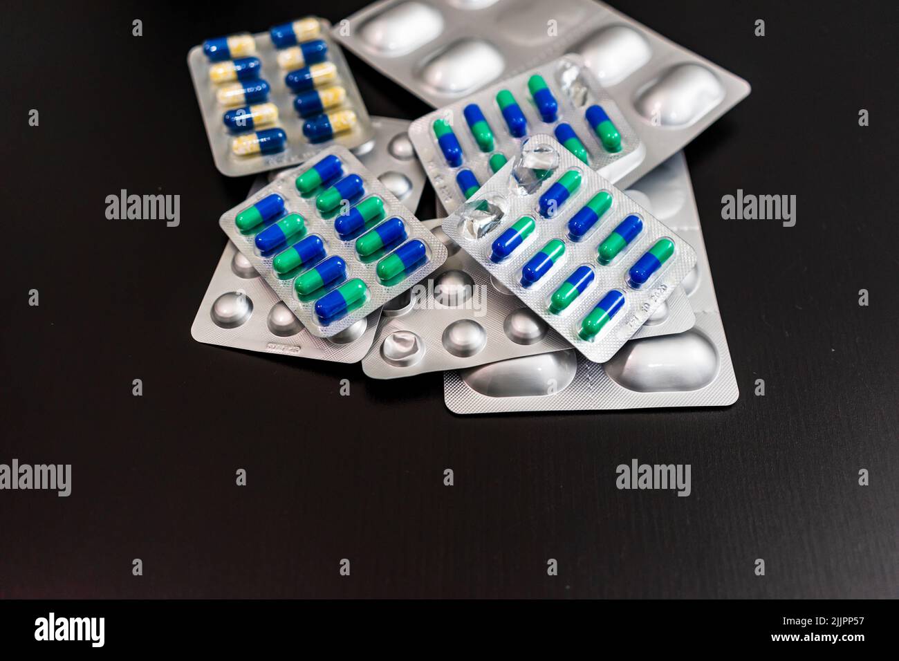 A closeup shot of Drug capsule pills, medicine and vitamins on the ...
