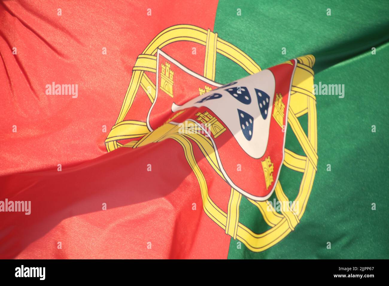 National flag of portugal waving hi-res stock photography and images ...
