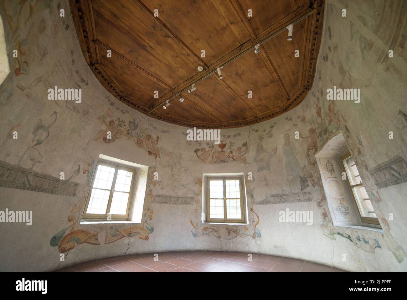 A beautiful interior of an old building with paintings on walls and a ...