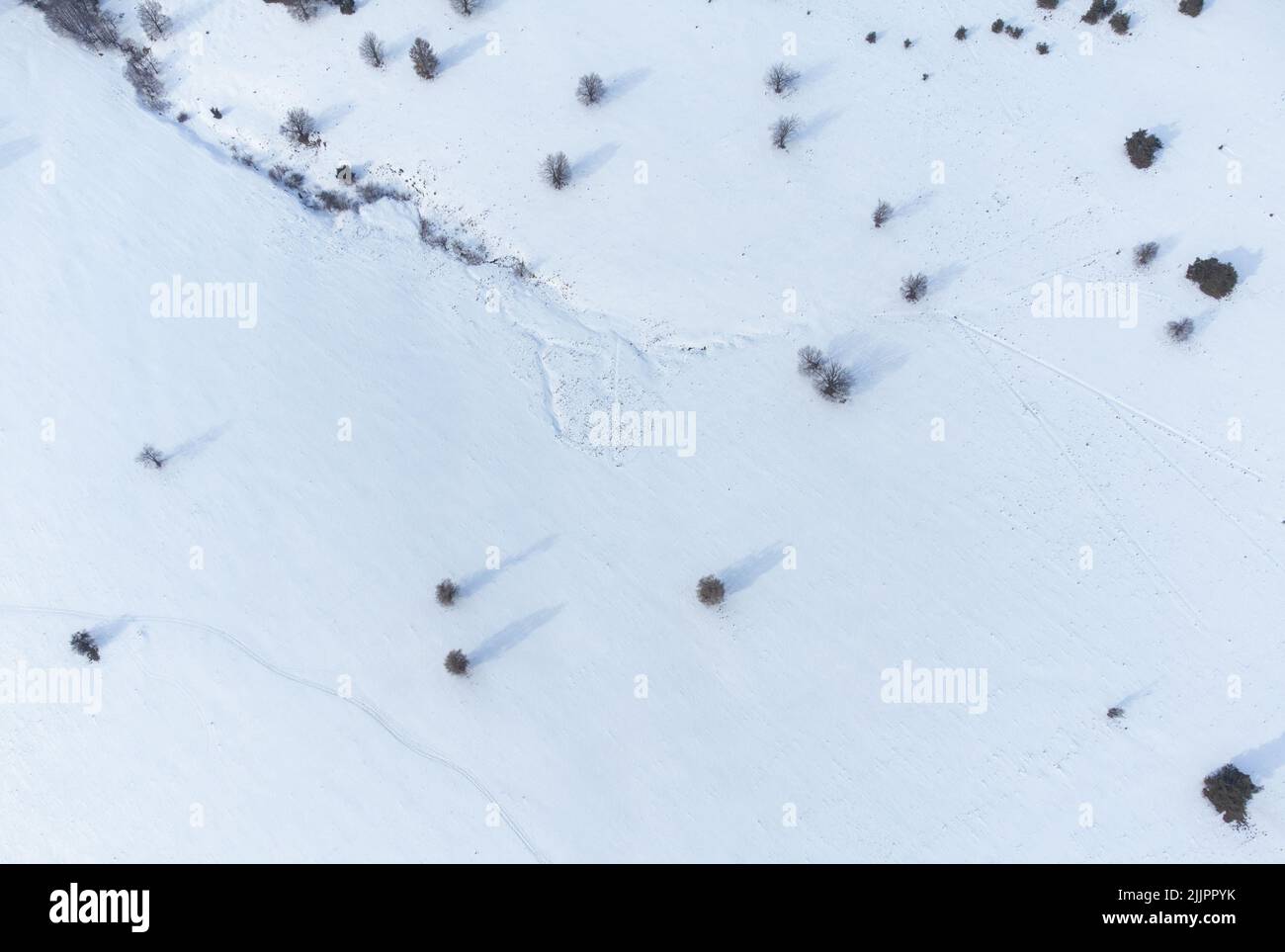 An aerial landscape with a field covered with snow Stock Photo - Alamy