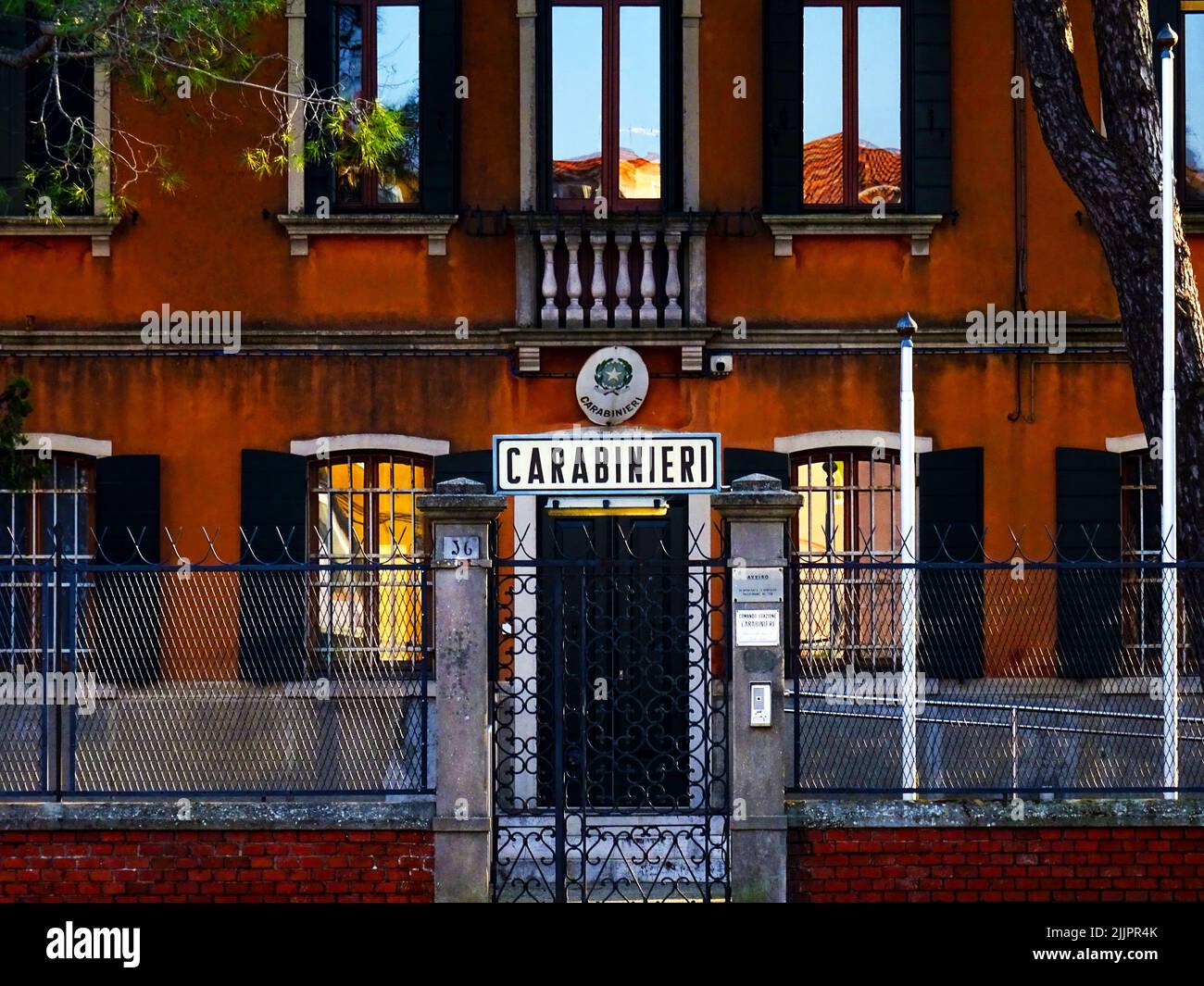 An exterior shot of a Police station in Burano Venice, Italy with urban ...