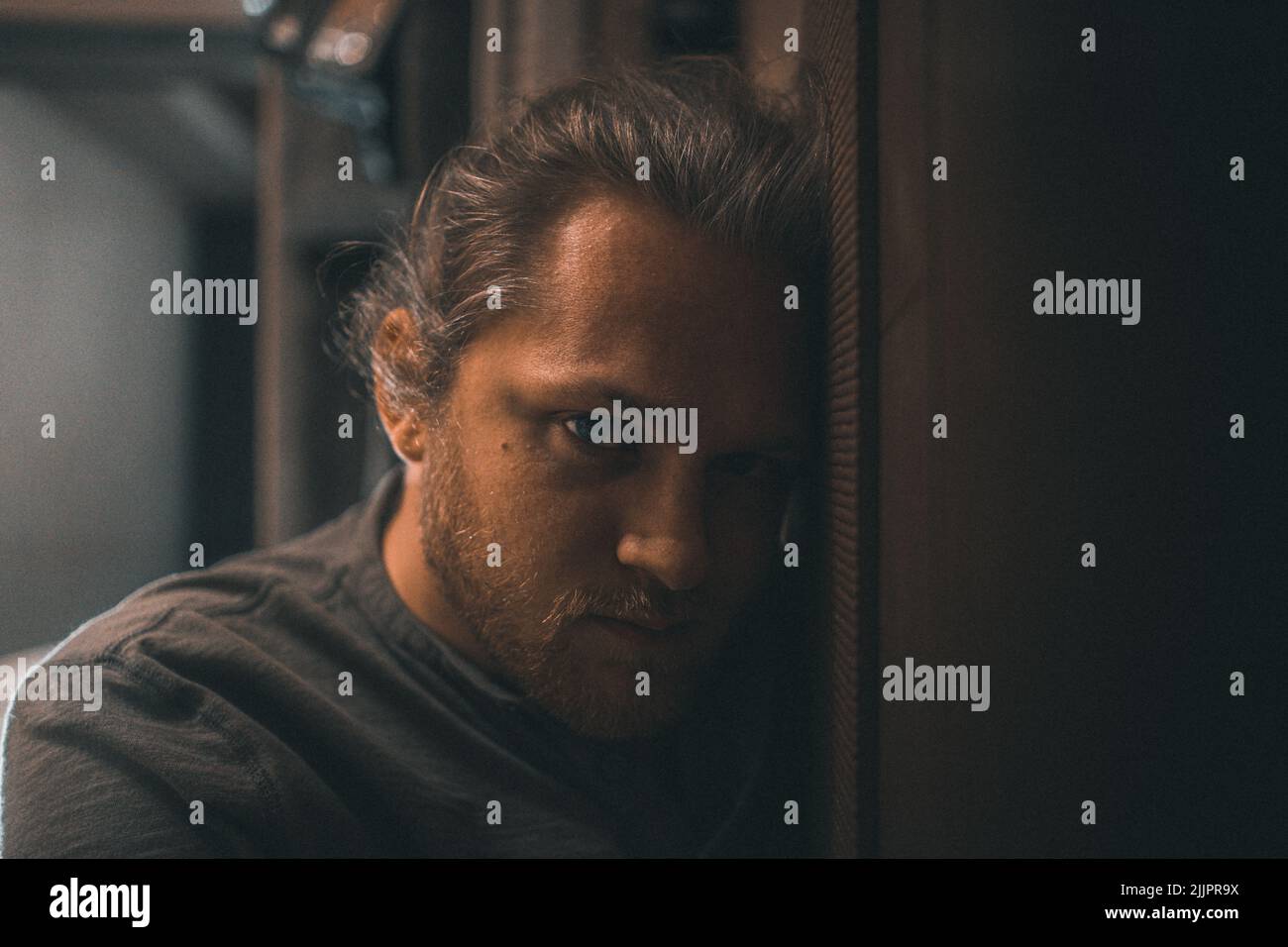 A young White man stuck in a hotel room for quarantine Stock Photo - Alamy