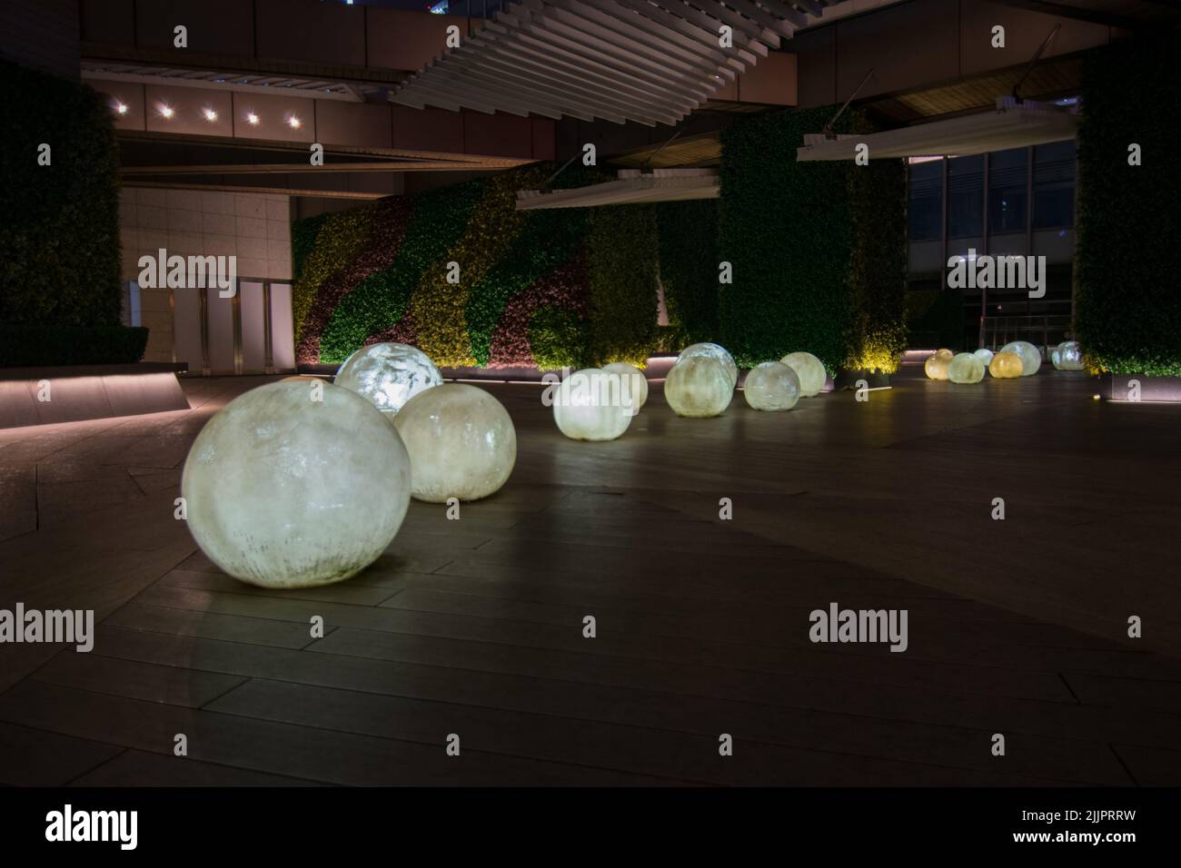 A beautiful shot with round lights on the ground of rooftop on colorful ...