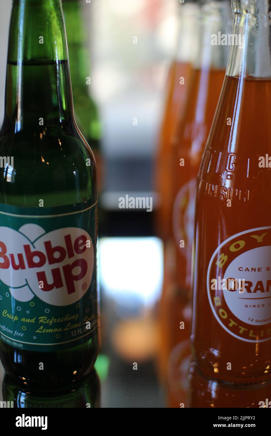 A selective focus shot of bottles of soda on a shelf in Fort Worth ...