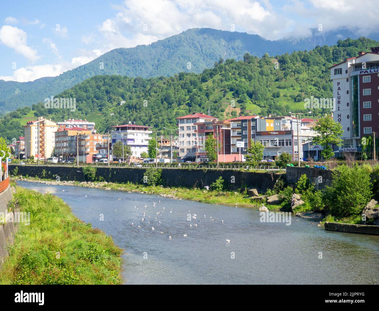 Beautiful quiet Turkish city on the banks of the river. Urban landscape ...