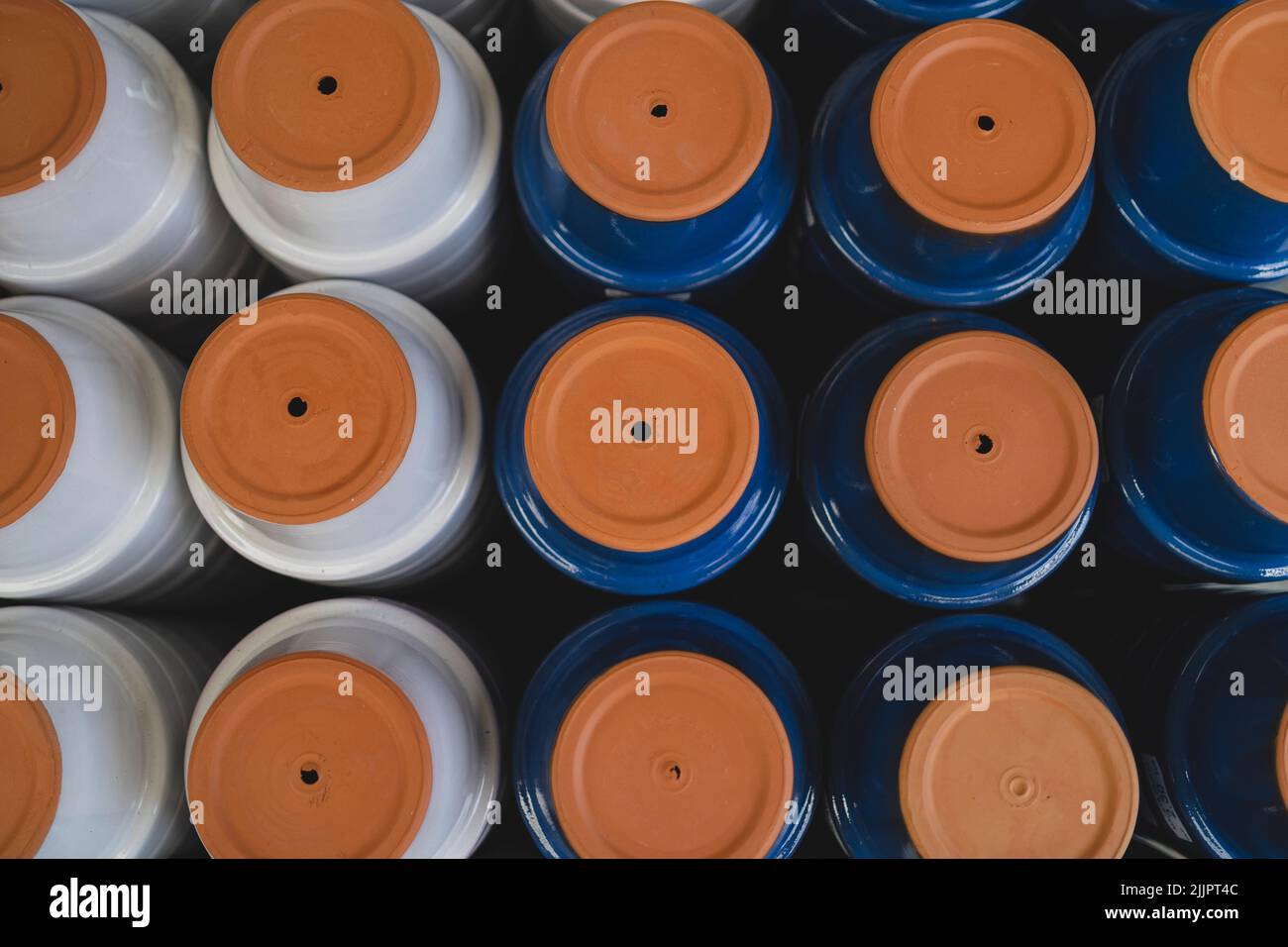 A top view of blue and white painted clay pots in the warehouse Stock ...