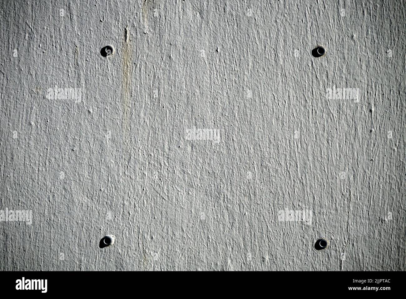 A white wall with four holes Stock Photo - Alamy