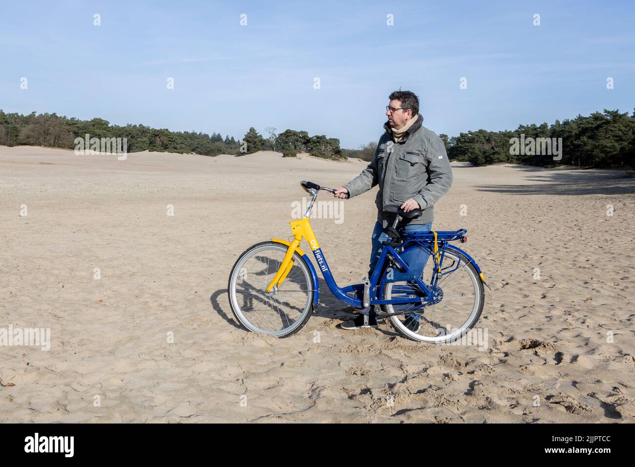 Male person with OV-fiets bike part of Dutch public transportation ...