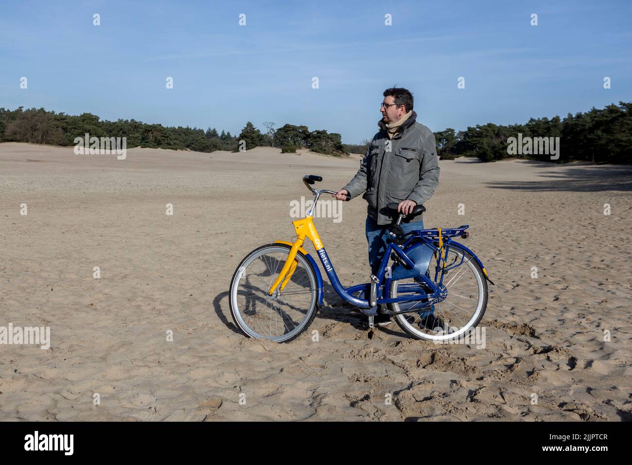 Male person with OV-fiets bike part of Dutch public transportation ...
