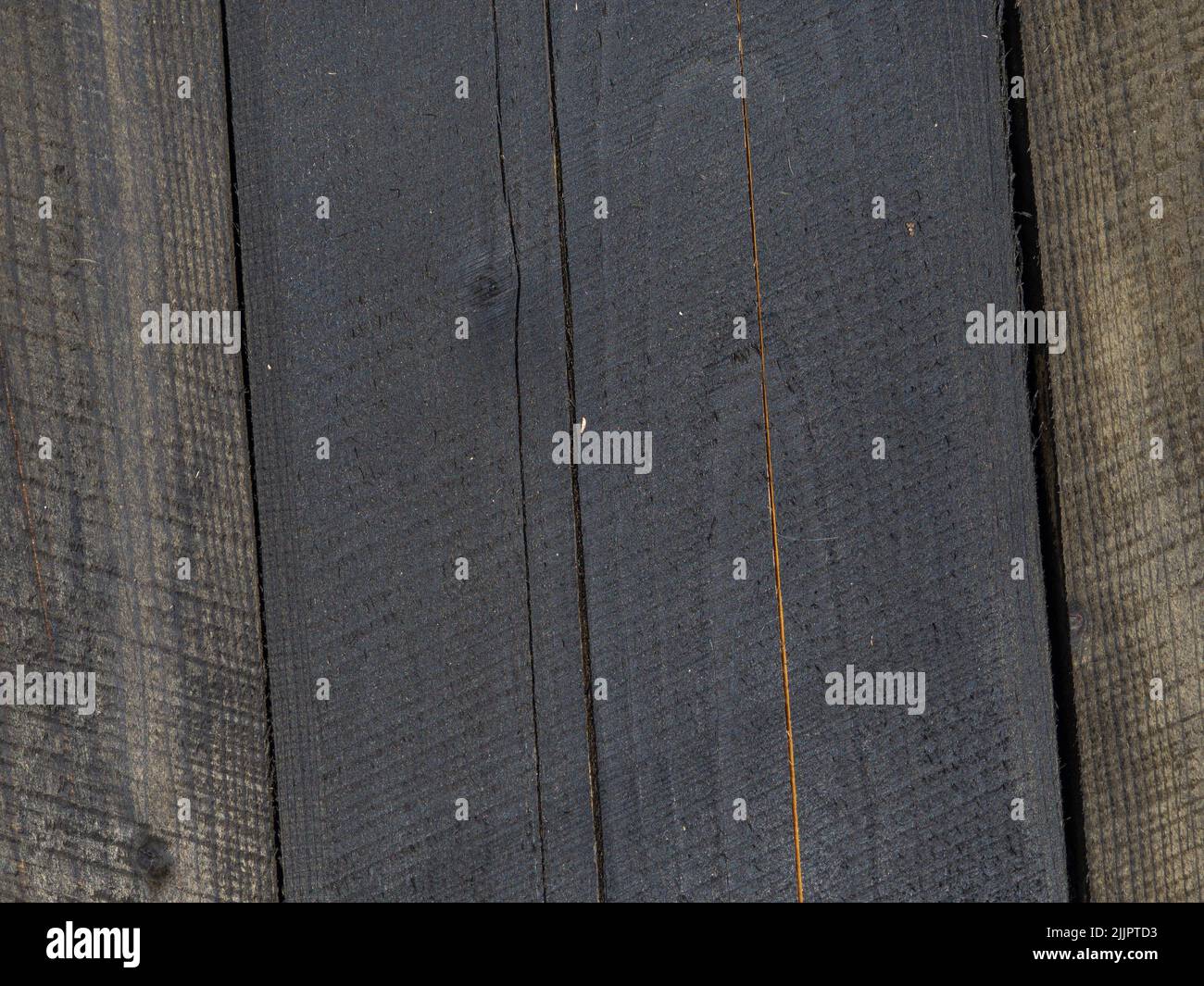 Background from burnt boards. Black wood. Burnt wood wall. Boards after ...