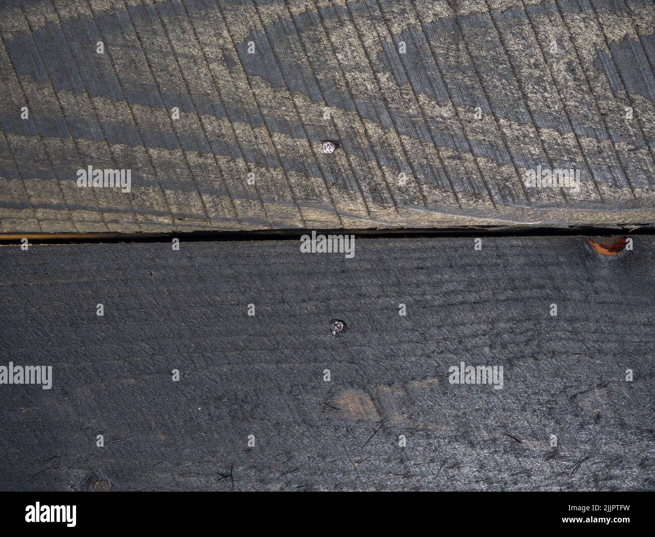 Background from burnt boards. Black wood. Burnt wood wall. Boards after ...