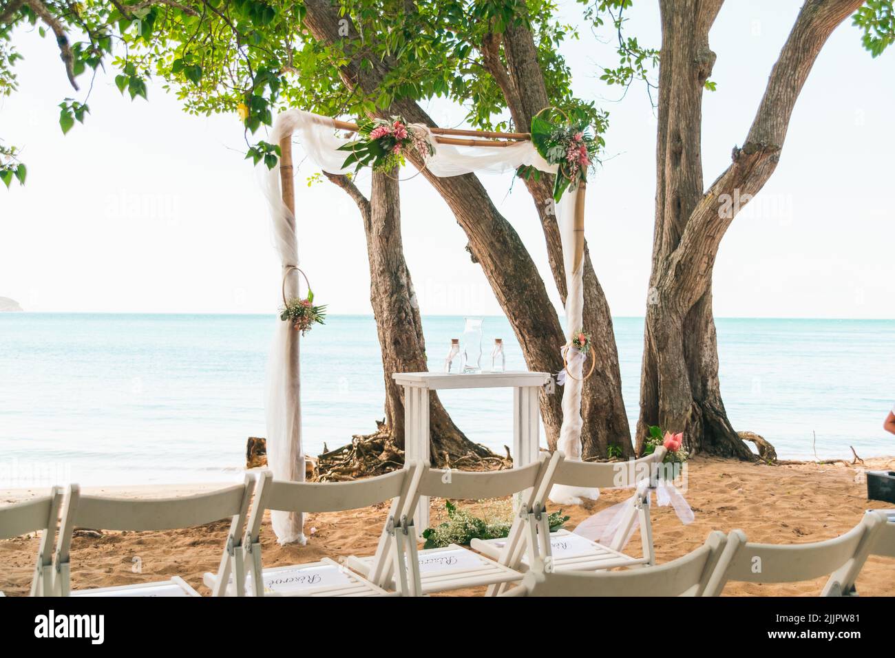 A simple beach wedding set up on the seaside Stock Photo - Alamy