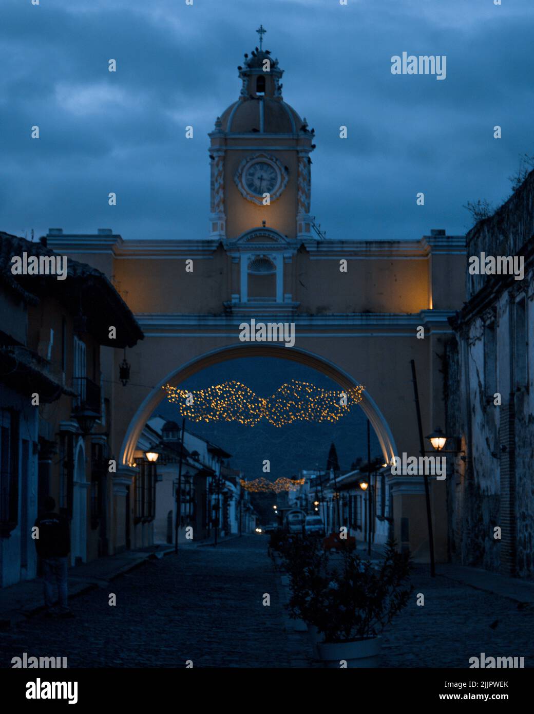 A view of Santa Catalina Arch surrounded by buildings in evening Stock ...