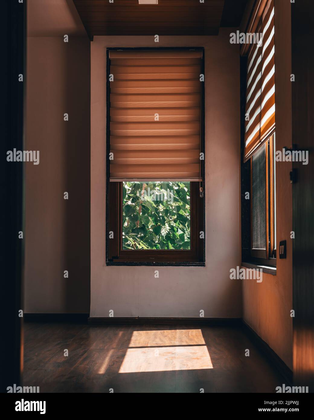 The sun peeking through the window of a room Stock Photo - Alamy