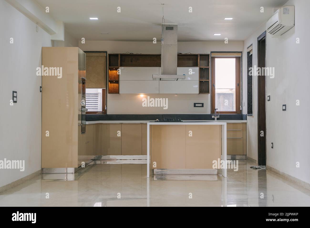 A kitchen setup of a modern apartment Stock Photo - Alamy