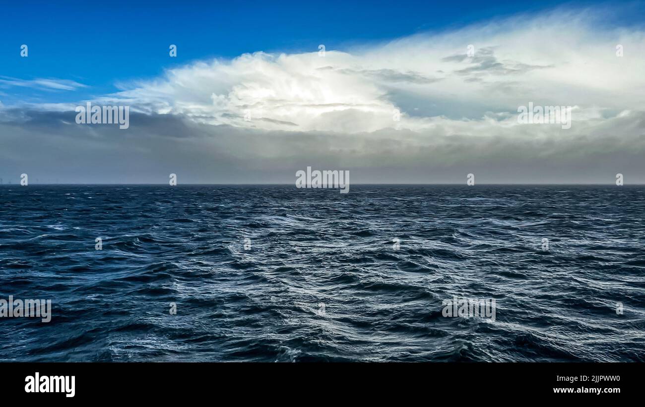 The beautiful calm sea under the cloudy sky Stock Photo - Alamy