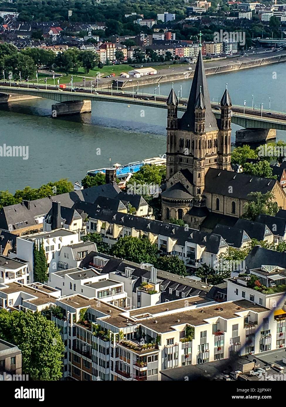 A vertical aerial view of the Cologne cityscape with the Great St ...