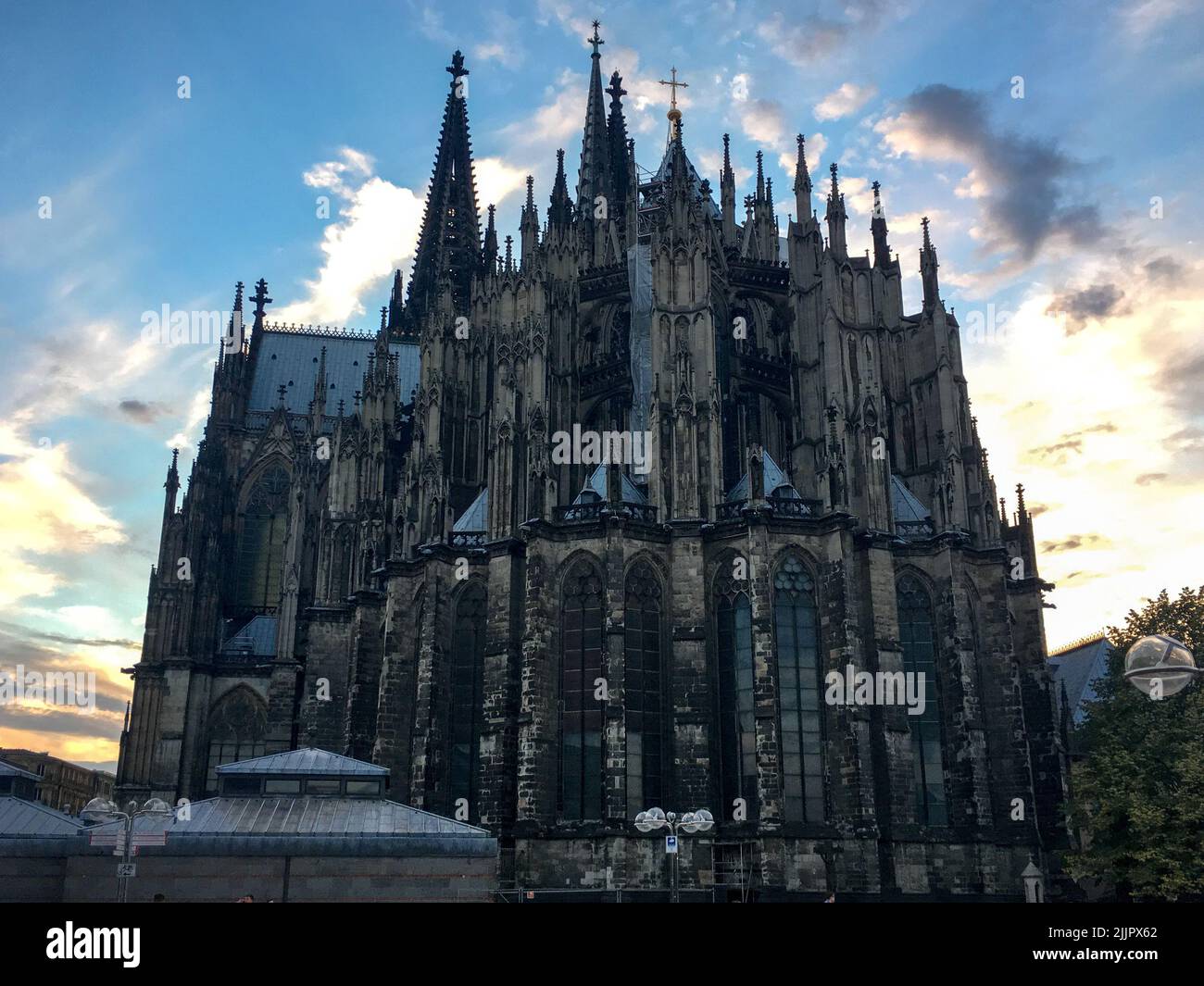 A low angle shot of the Cologne Cathedral in Germany against the blue ...