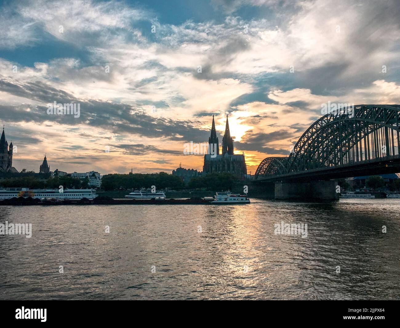 A scenic view of Cologne cityscape with the Hohenzollern Bridge and the ...