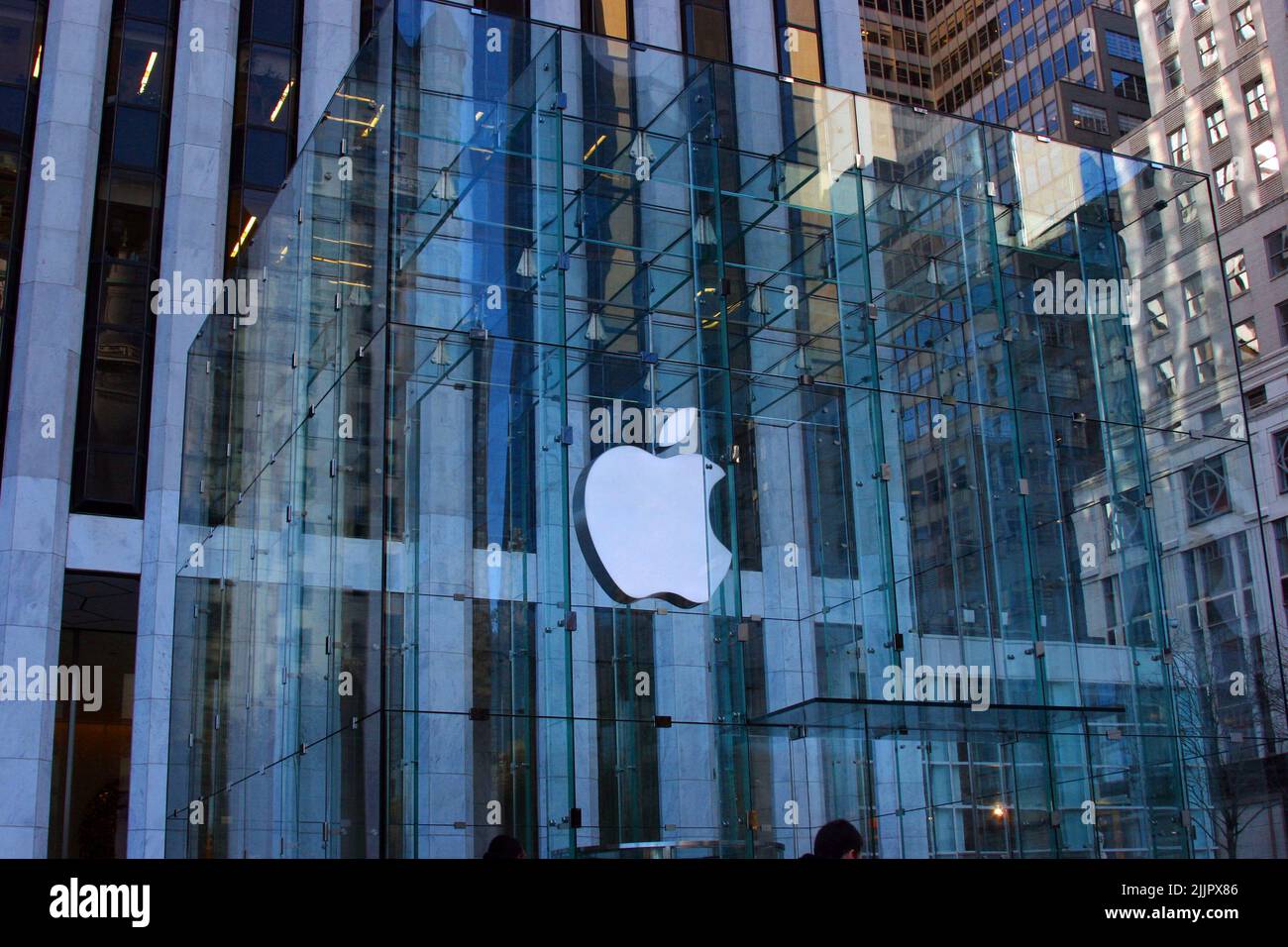 A close-up shot of the Apple Company glass building in New York City ...
