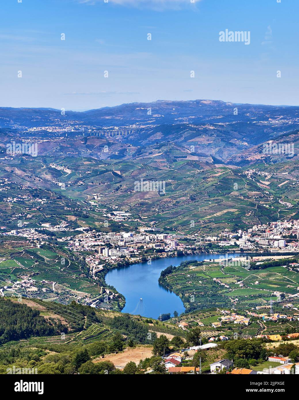 An aerial view of the Douro river valley in Peso da Regua with the city ...