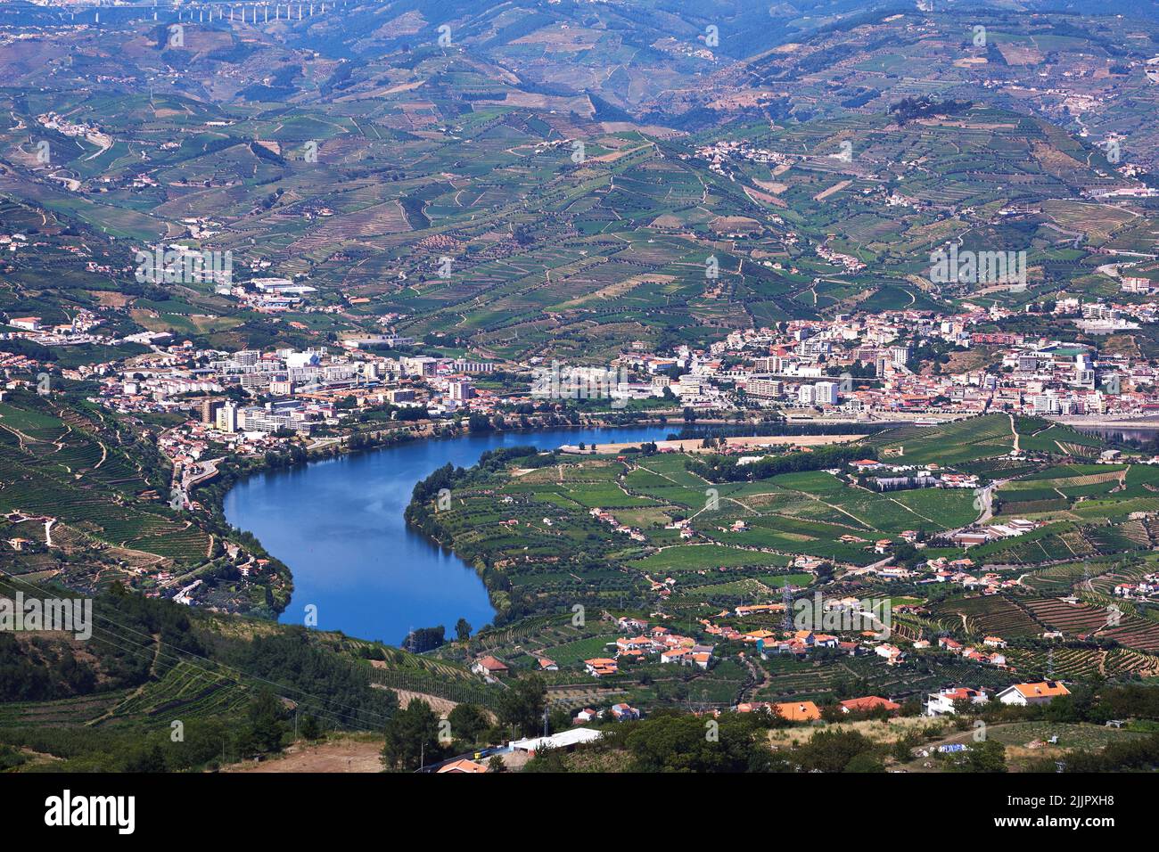 An aerial view of the Douro river valley in Peso da Regua with the city ...