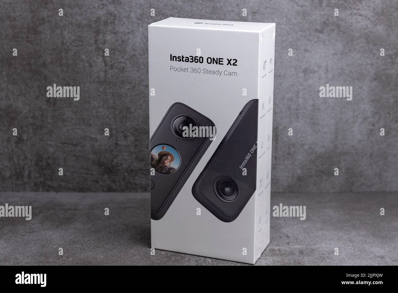 Frontal view of One X2 Insta360 new package camera box against a modern ...