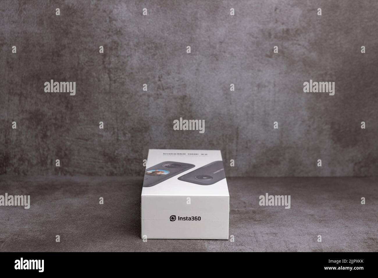 One X2 Insta360 new package camera box against a modern contemporary ...