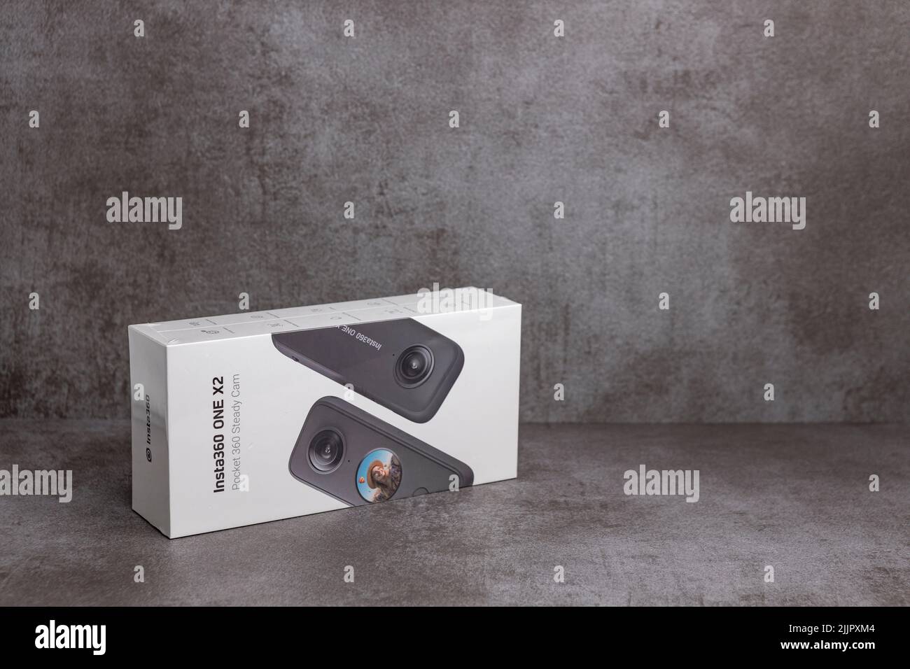 Laying down Insta360 ONE X2 new package camera box against a modern ...