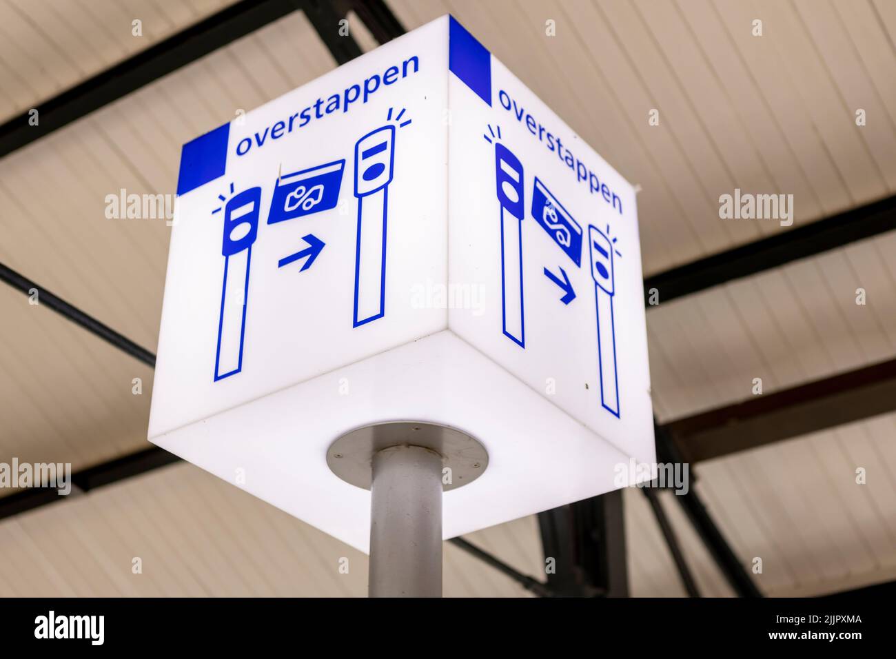 Square sign informing the location of transference of one train company ...