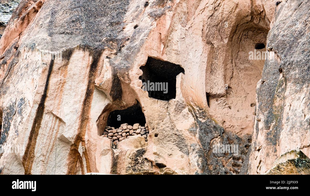 Geological formations with holes in them in Cappadocia, Turkey Stock ...