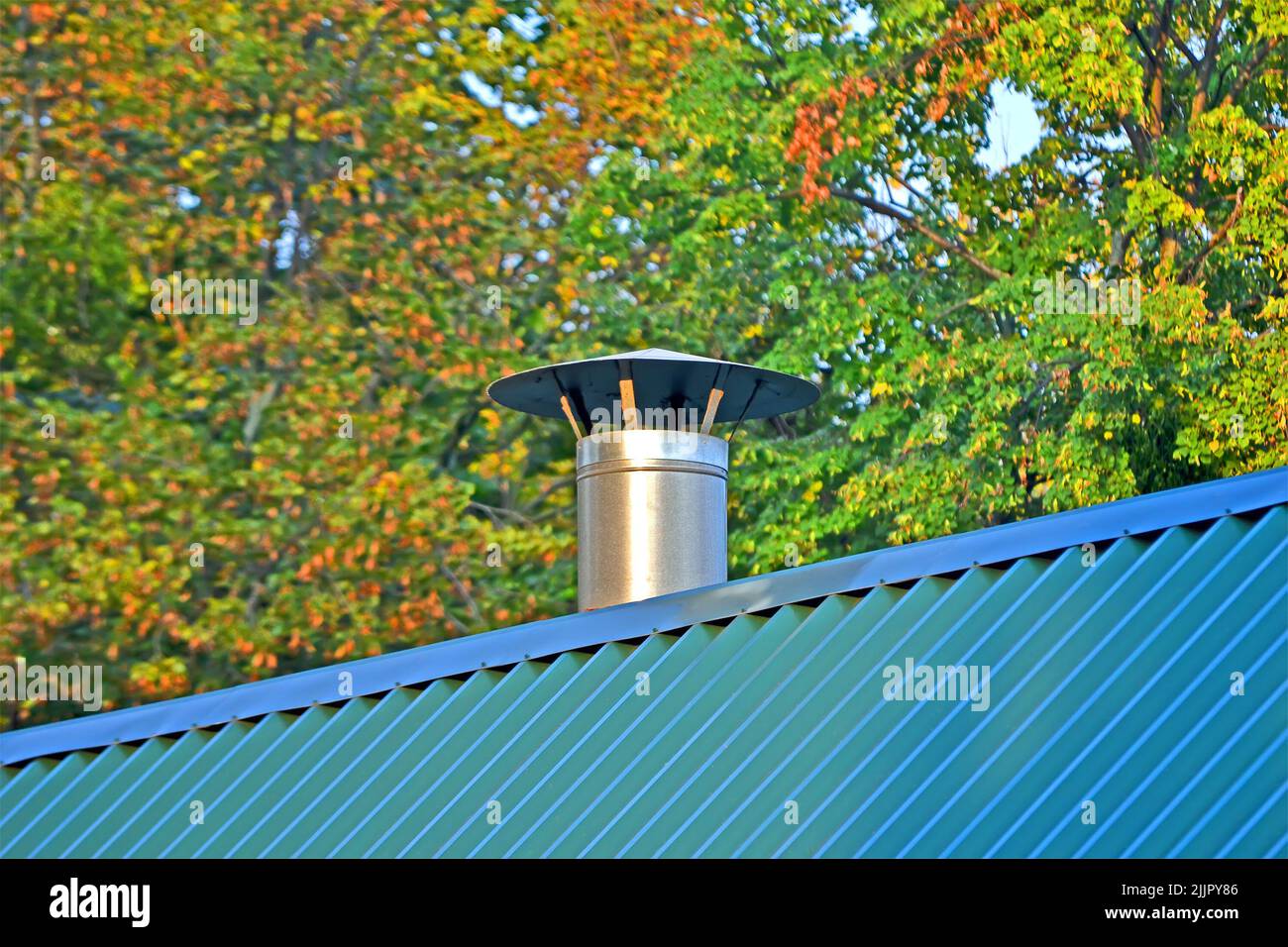 metal silver pipe on the blue roof, ecological environment diversity ...