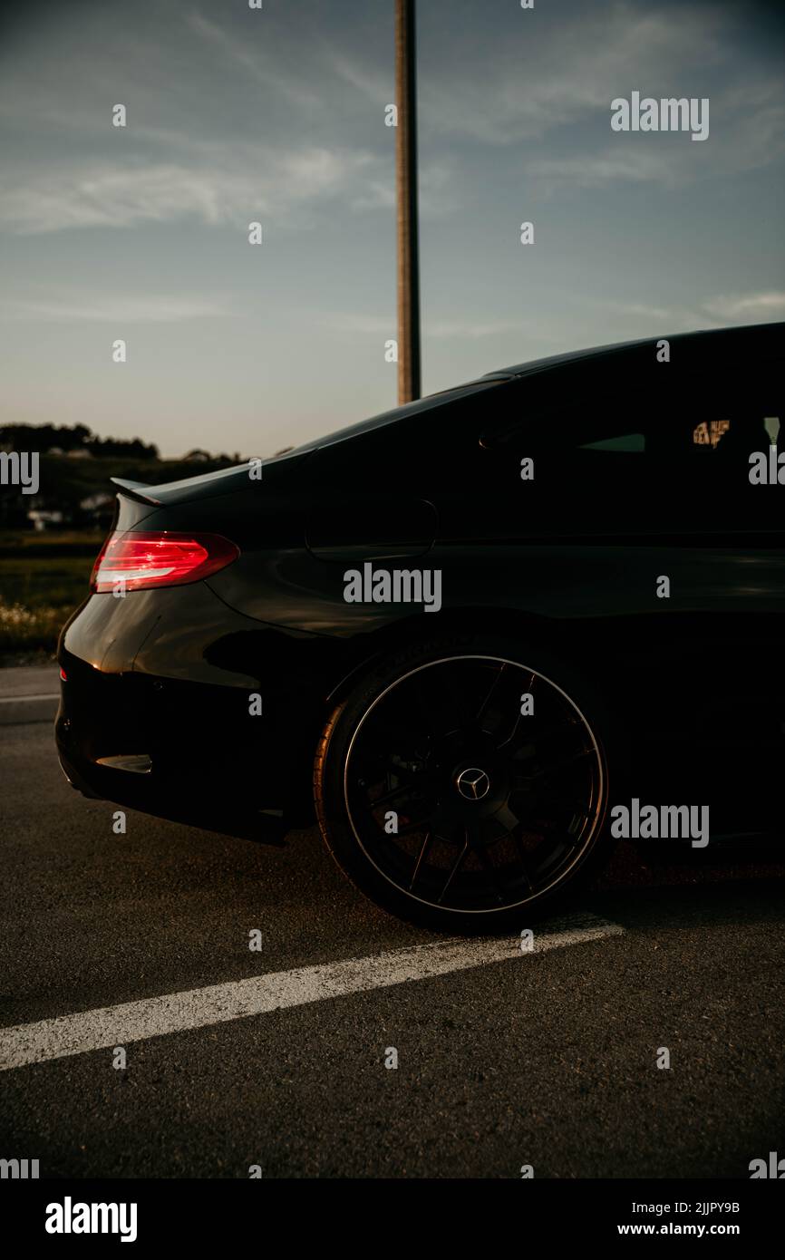 A side view of a black car Stock Photo - Alamy