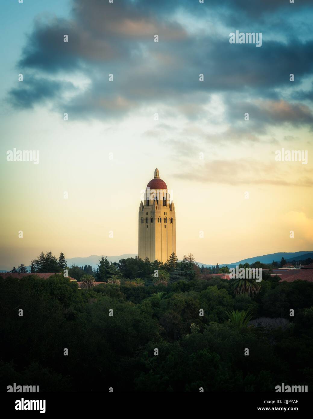 A vertical shot of the Hoover tower under the cloudy skies in the ...