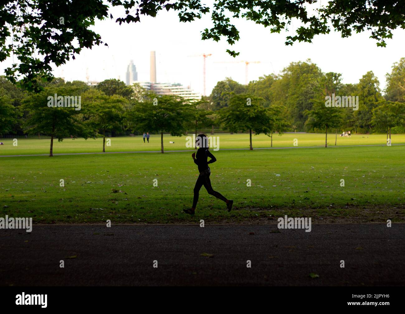 A female jogging in the Battersea Park in London, England Stock Photo ...