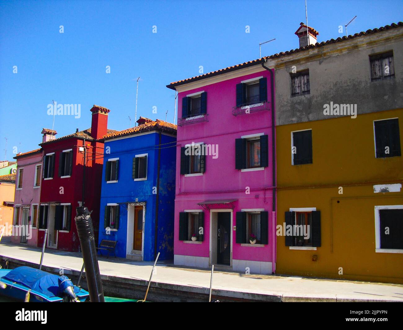An old colorful residential building facade in street of Murano Stock ...