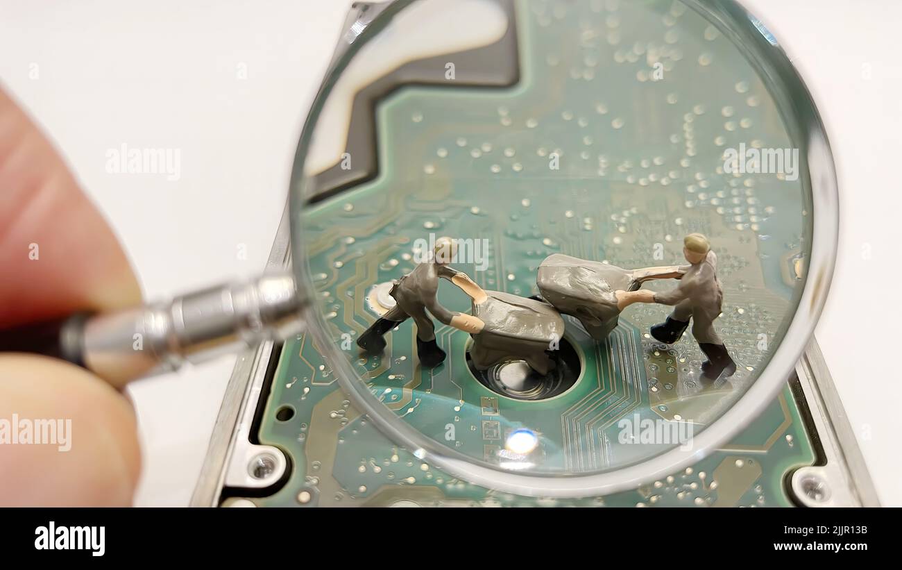 The miniature people working on a CPU board Stock Photo - Alamy