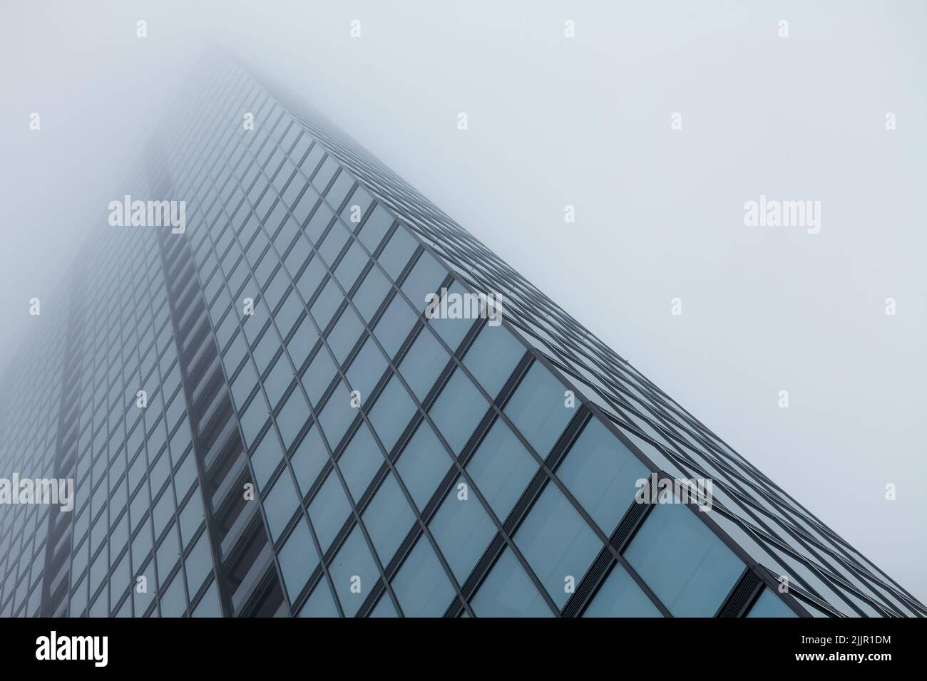 An abstract views of a skyscraper on a foggy day Stock Photo - Alamy