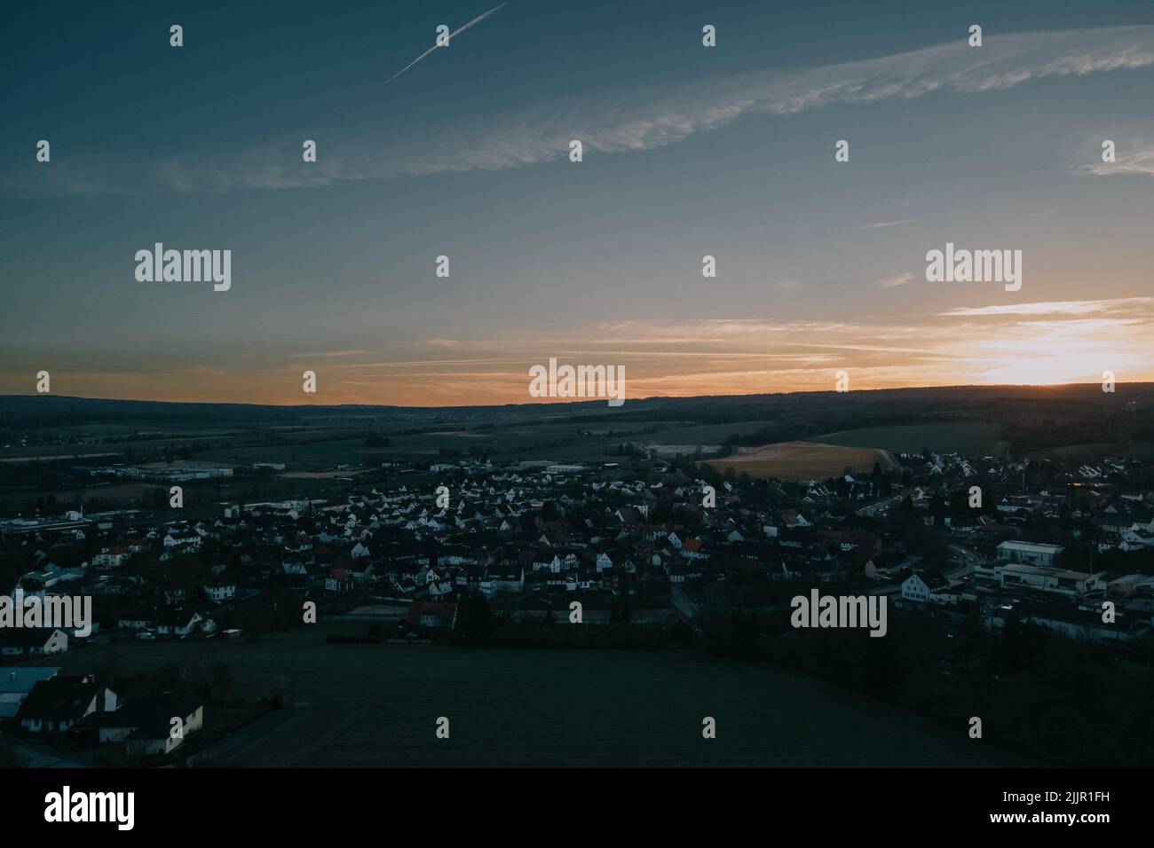 An aerial view of buildings in a town during sunrise Stock Photo - Alamy
