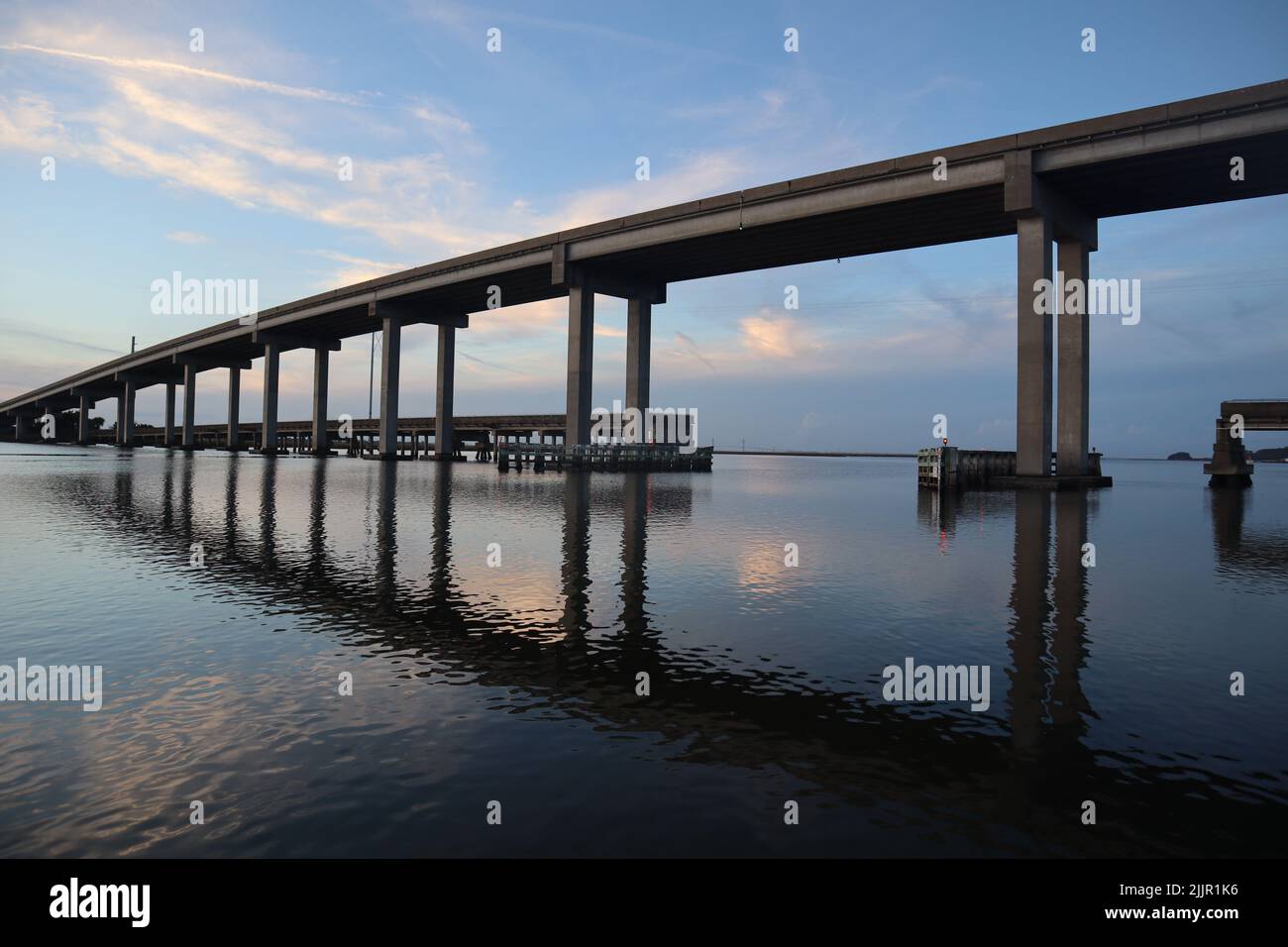 A scenic view of the Bridge over a calm coast in Jekyll Island, Georgia ...