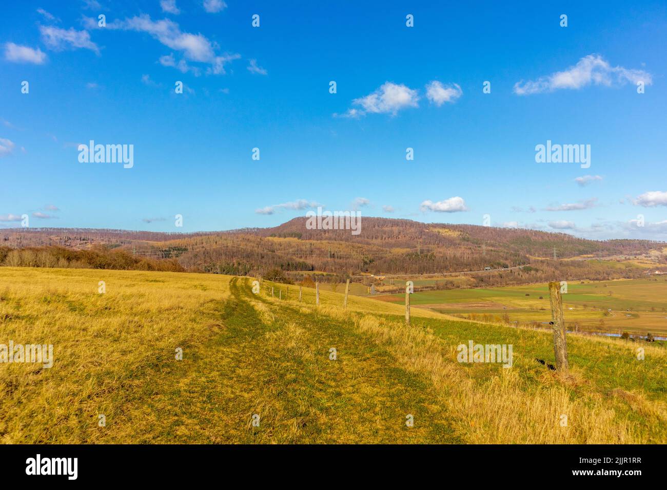 A beautiful landscape with meadows and architecture at the Werra valley ...