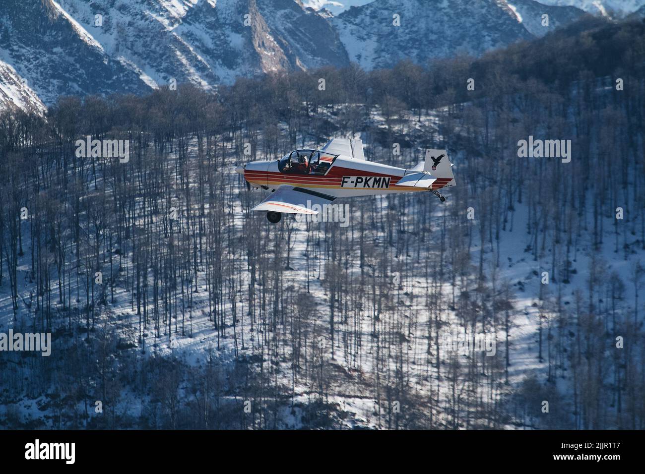 An aerial view of an aircraft flying over snow-capped mountains Stock ...