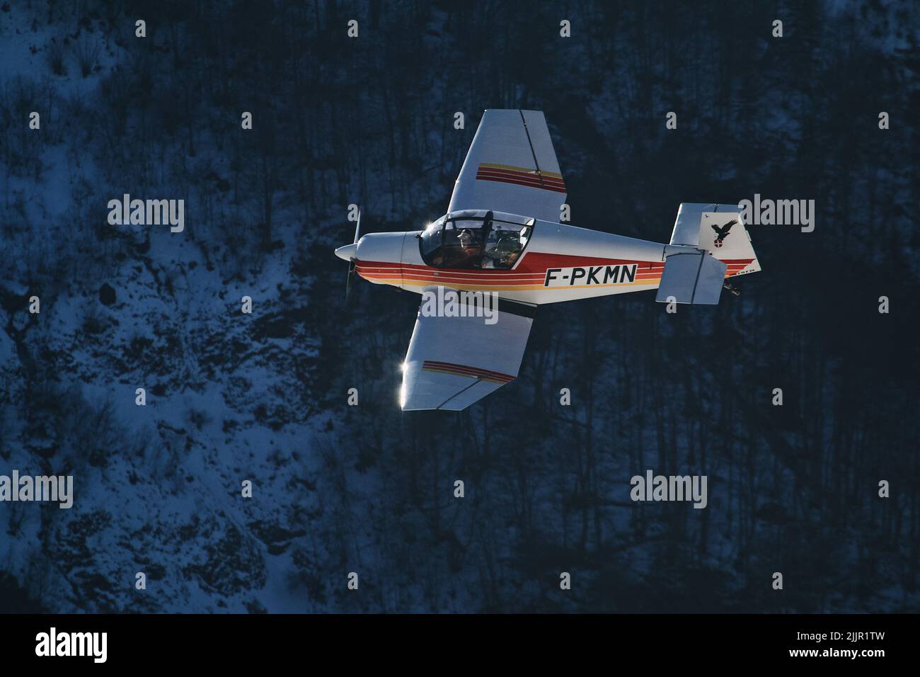 An aerial view of an aircraft flying over snow-capped mountains Stock ...